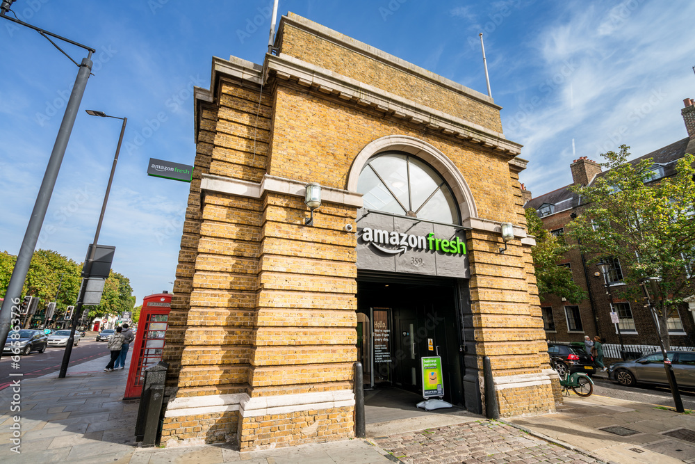 Green sign with logo Amazon Fresh at the entrance to the Amazon Fresh ...