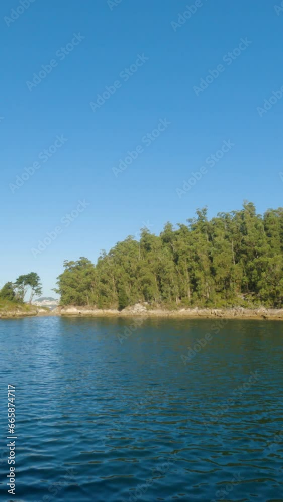 Journey along Tambo Island, capturing its rocky shores, and distant ...
