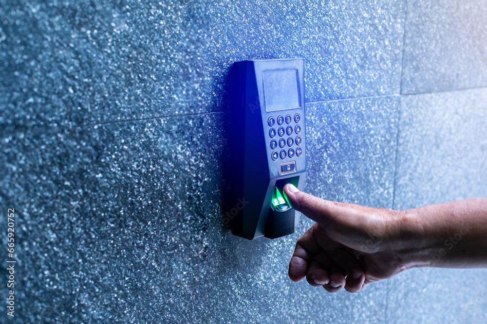 man push finger down on the electronic control machine to access the ...