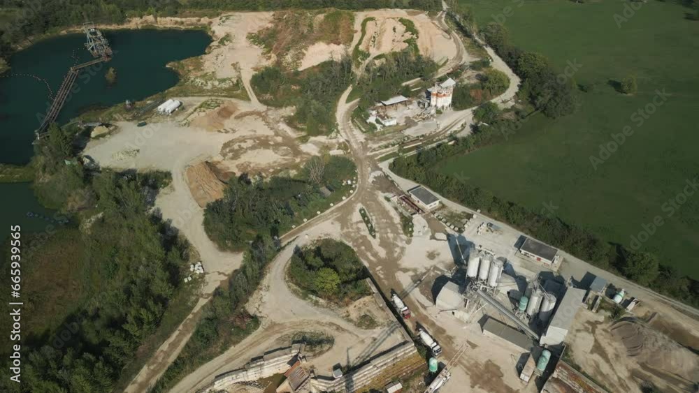 Aerial view of a manufacturing plant that produces sandy materials for ...