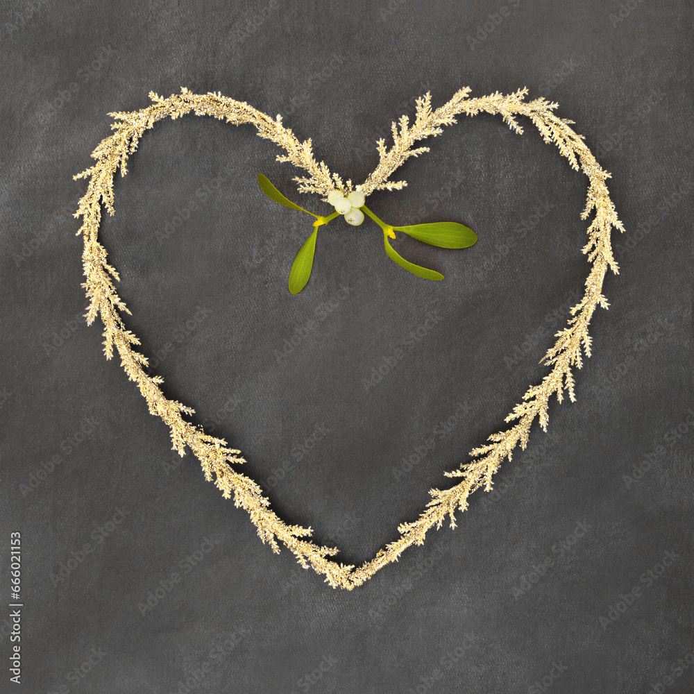 Christmas gold tinsel heart shape wreath with mistletoe sprig ...