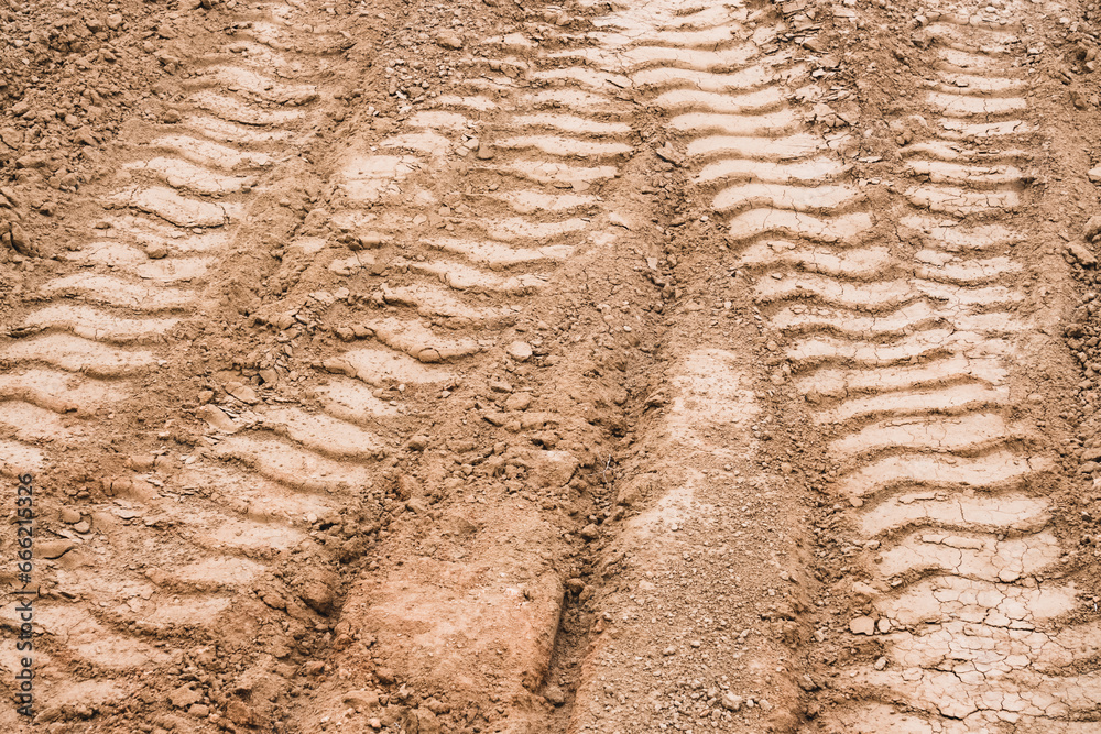 Texture of traces on the ground from the tread of trucks and tractors ...