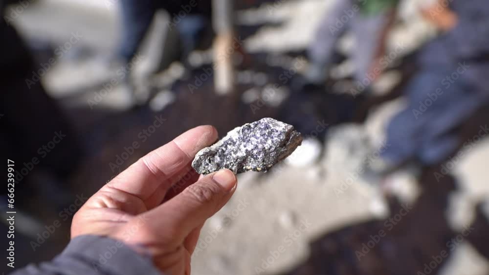 Vidéo Stock silver ore in shape of a small rock that needs to be ...