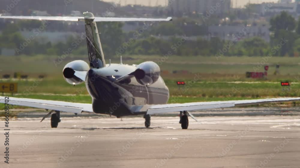 Close up of a small two engines jet airplane in shimmer haze prepare ...