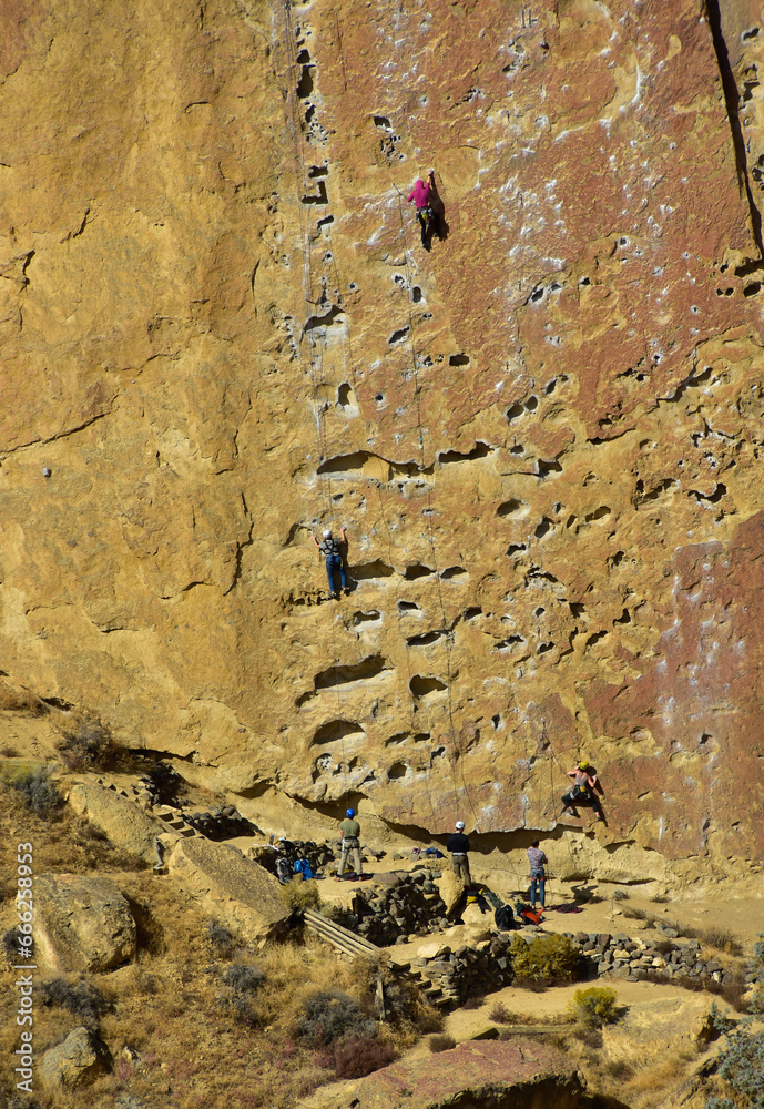 Climbers on sheer face of basalt spire in Red Rock state park, central ...