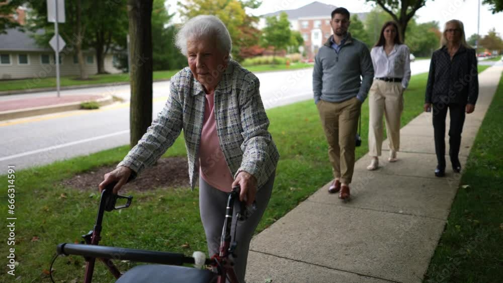 Slow motion of elderly senior old woman using walker for mobility on ...