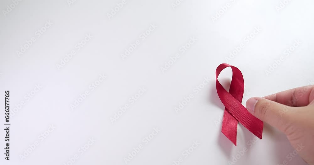 Placing a red ribbon on the right side of the frame which signifies the ...