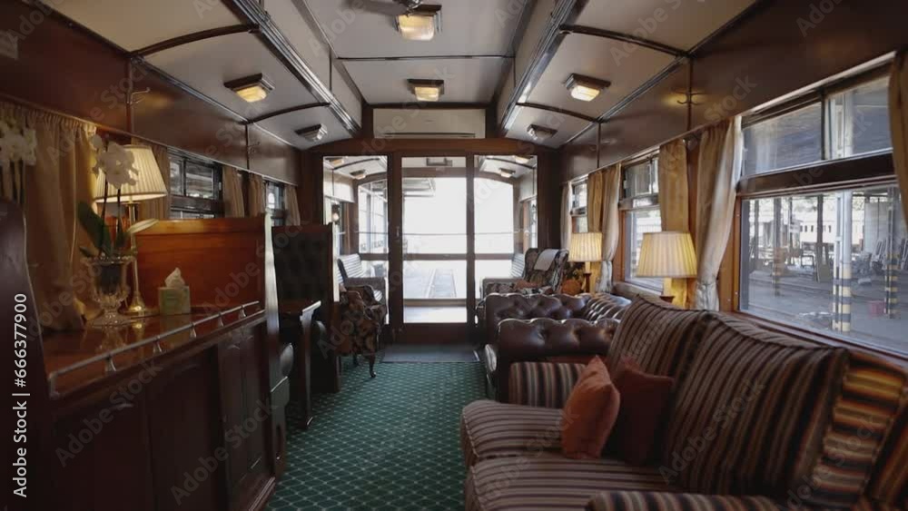 Amidst the rhythmic clatter of rails, an observation car on a luxury ...