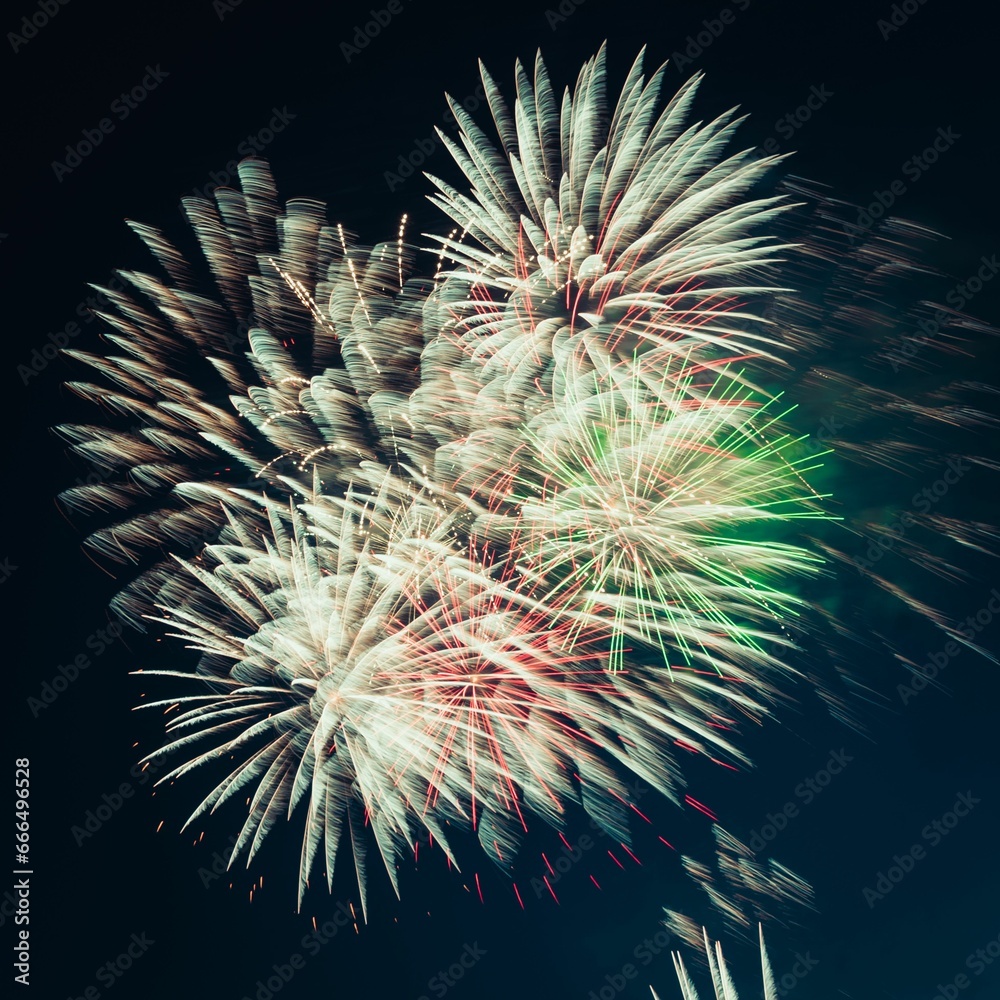 Spectacular night sky with a vibrant display of sparkling fireworks in ...