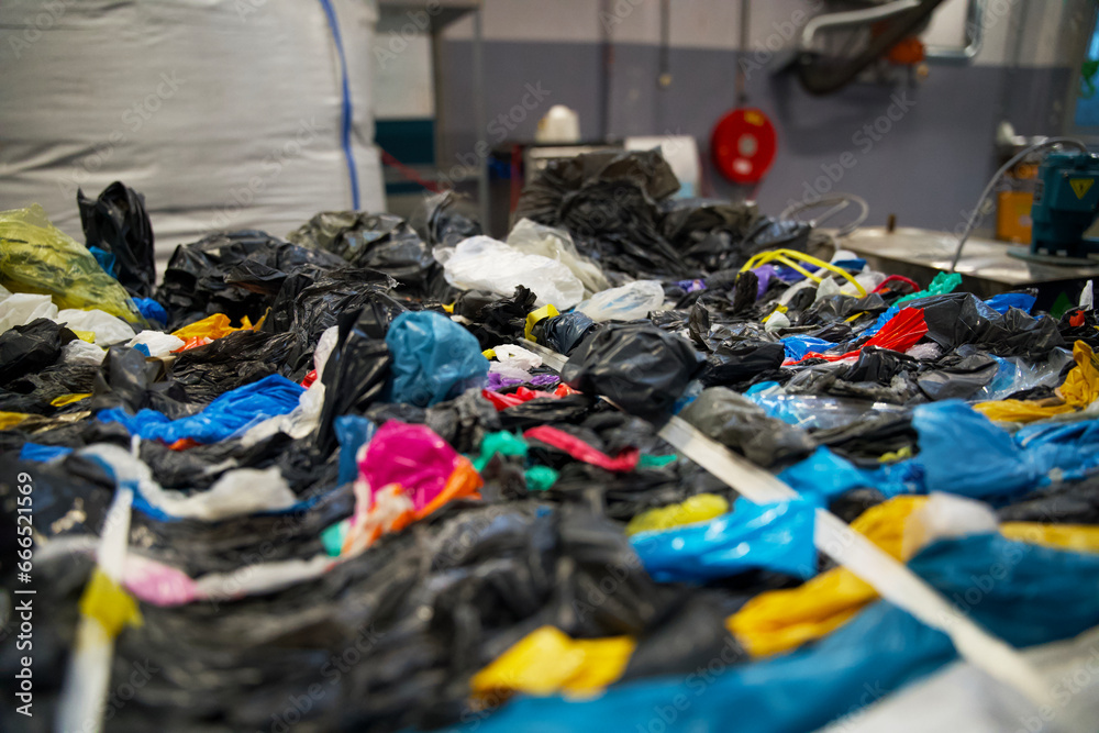Stack of plastic residual mix waste in a plastic recycling factory ...