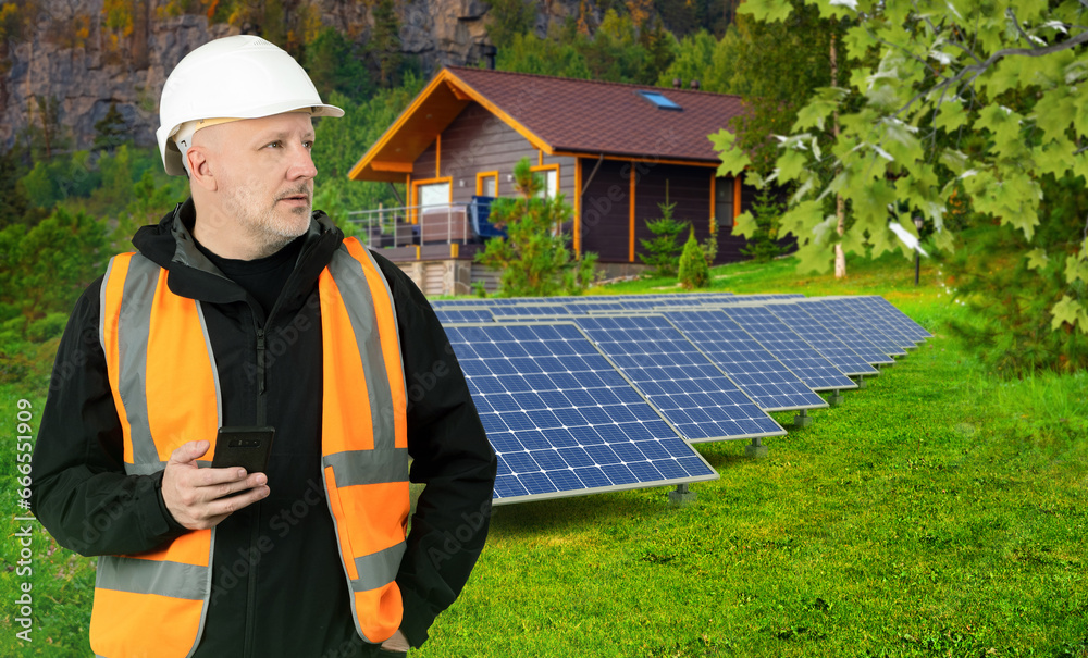 Foto de Solar energy. Man near solar panels. Country house with mini ...