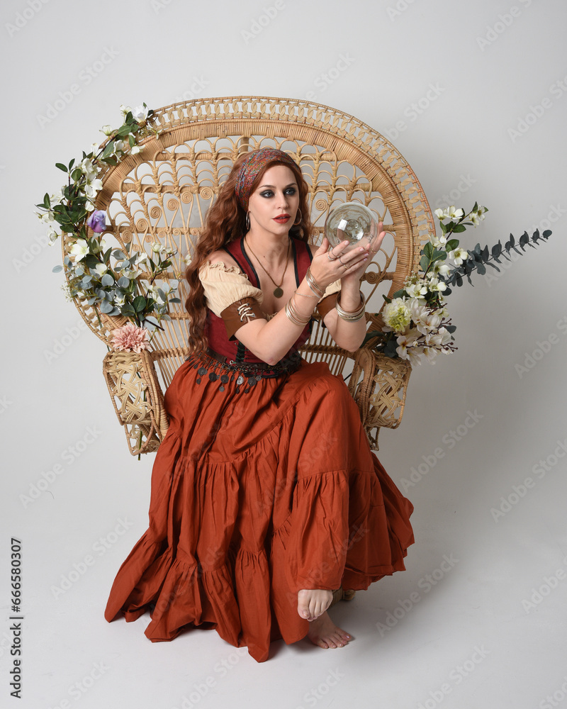 Full length portrait of beautiful red haired woman wearing a medieval ...