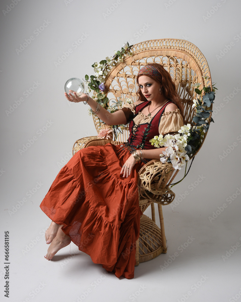 Full length portrait of beautiful red haired woman wearing a medieval ...
