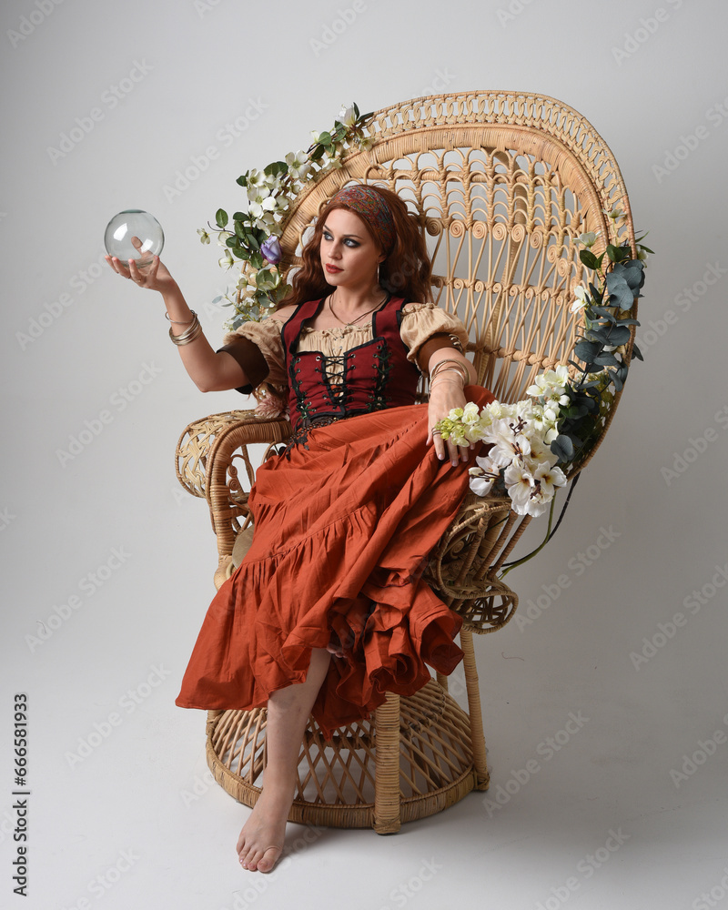 Full length portrait of beautiful red haired woman wearing a medieval ...