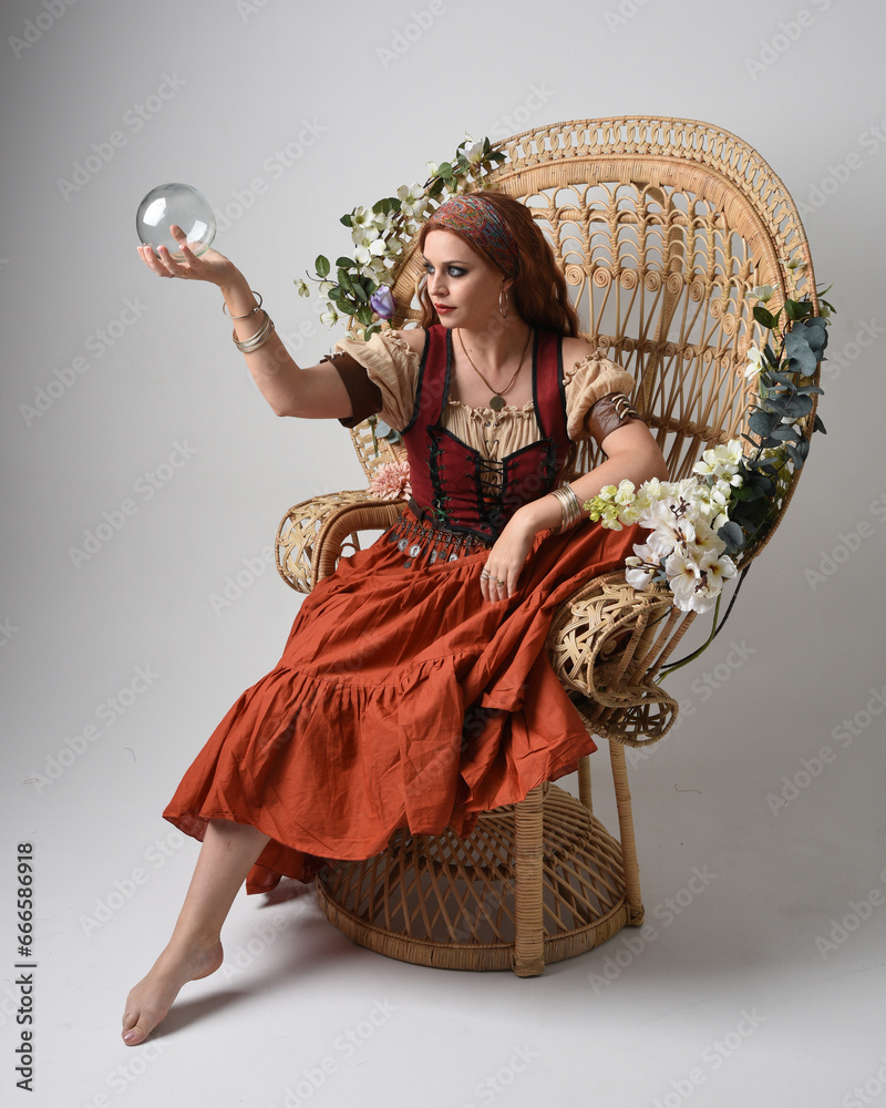 Full length portrait of beautiful red haired woman wearing a medieval ...
