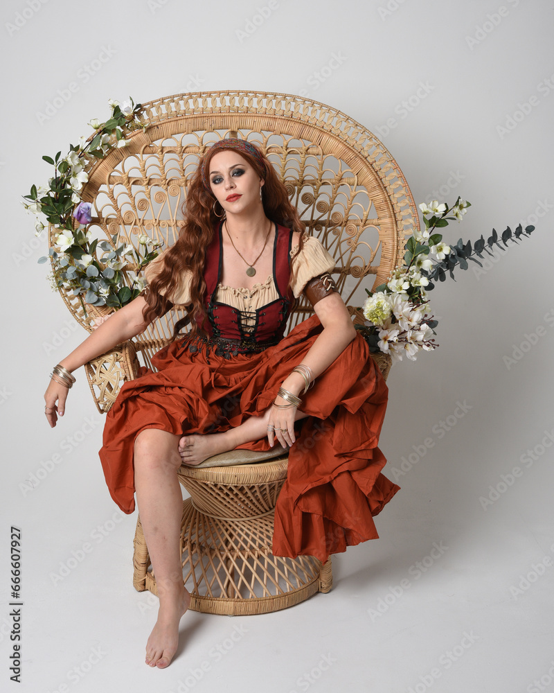Full length portrait of beautiful red haired woman wearing a medieval ...