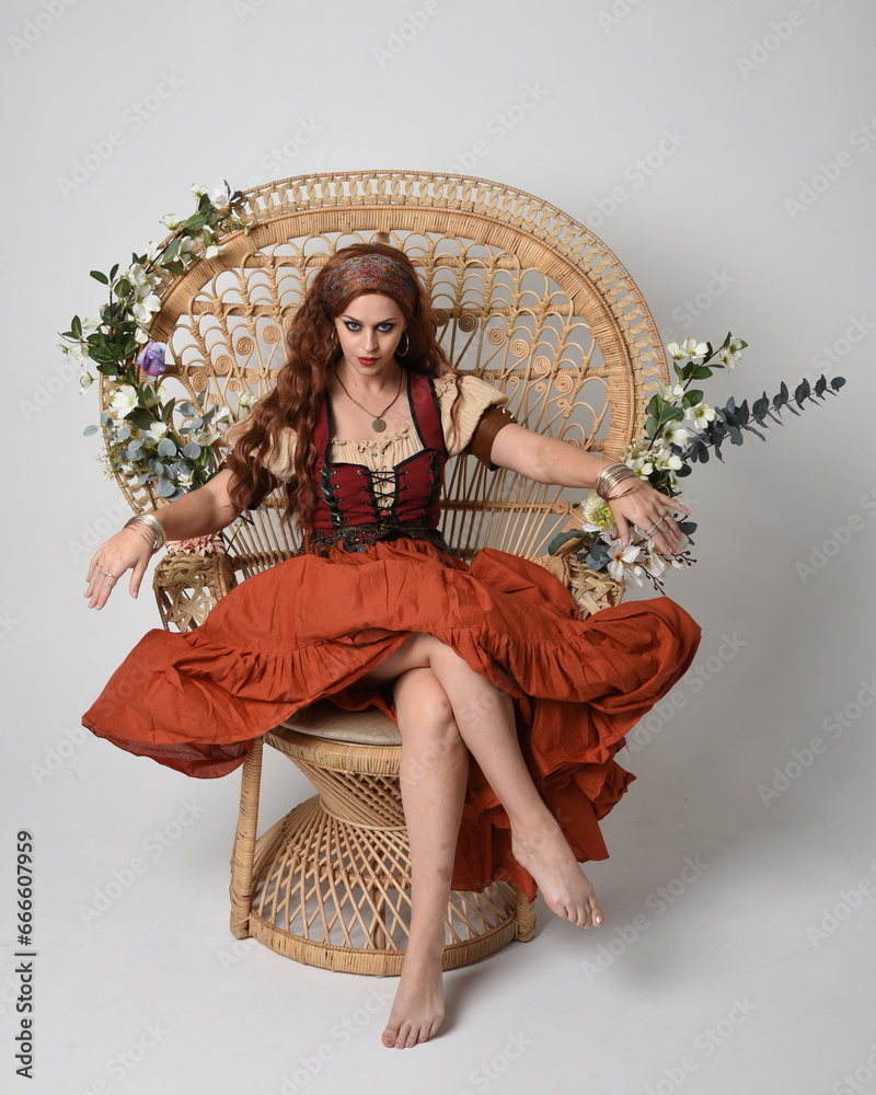 Full length portrait of beautiful red haired woman wearing a medieval ...
