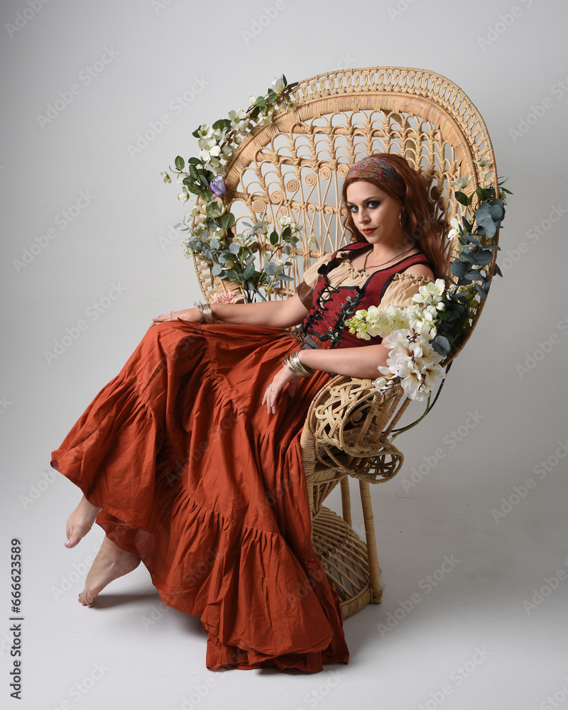 Full length portrait of beautiful red haired woman wearing a medieval ...