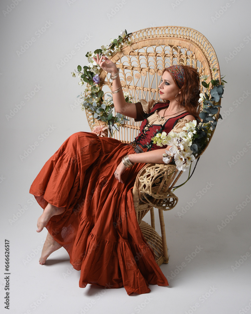 Full length portrait of beautiful red haired woman wearing a medieval ...