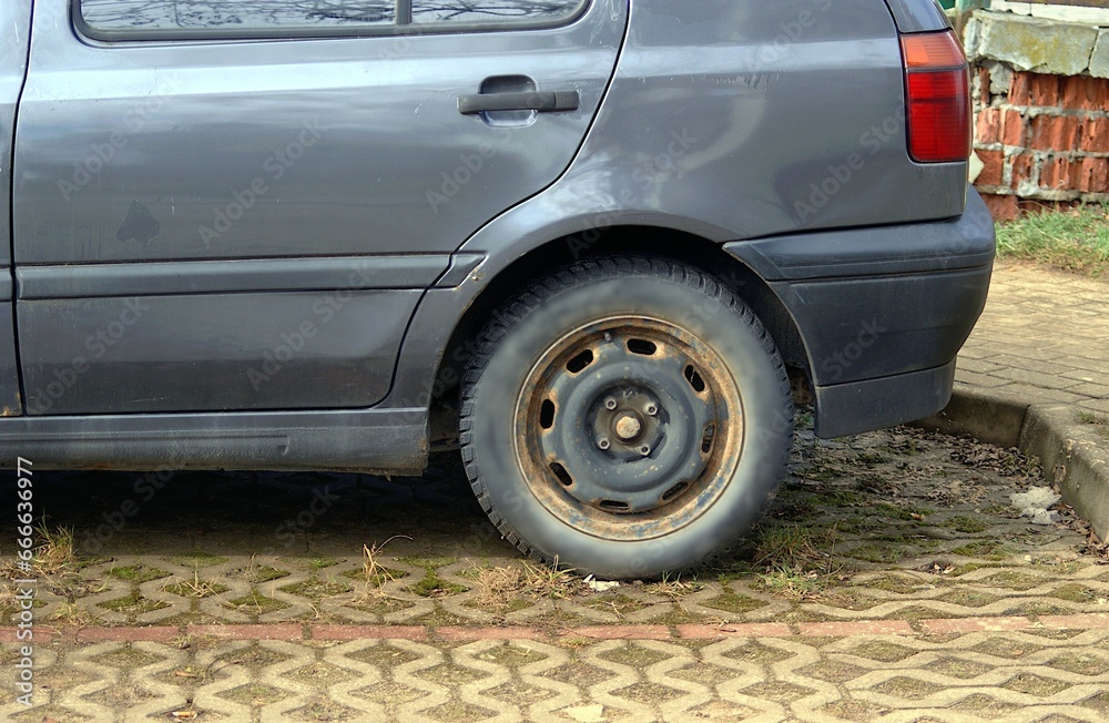 Wheel of a passenger car without a hubcap with a rusty steel rim Stock ...