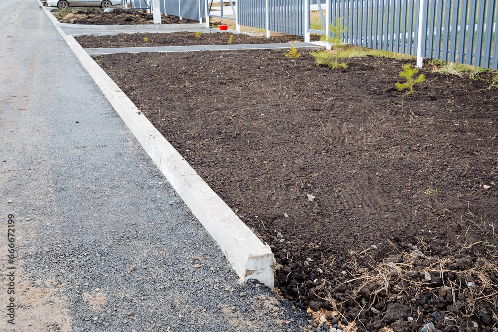 Adjacent territory, new asphalt, junction of the road and curb, land on ...