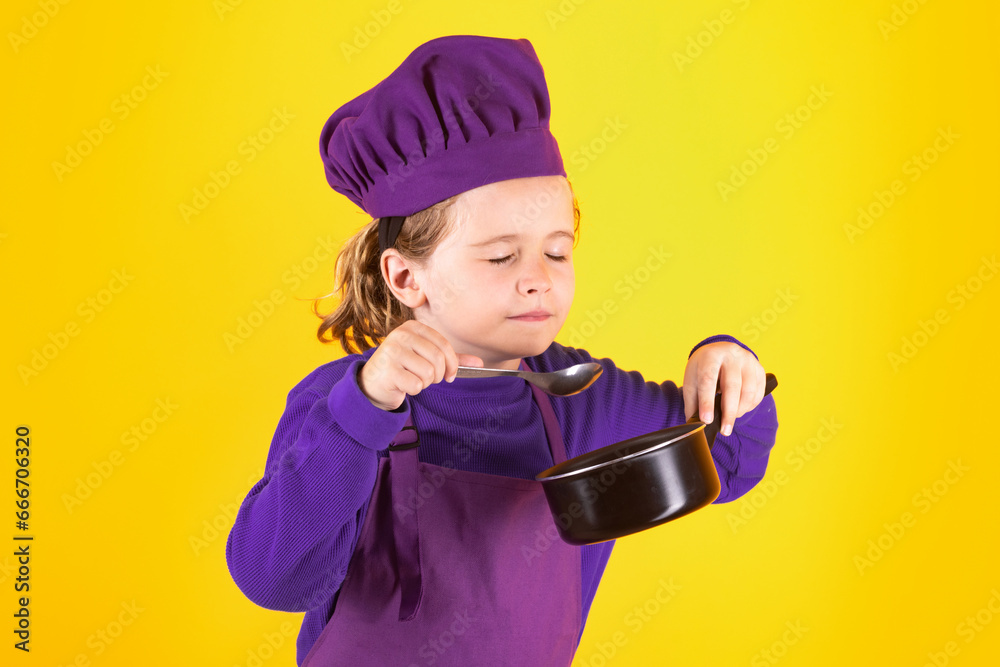 Kid chef cook with cooking pot stockpot. Portrait of little child in ...