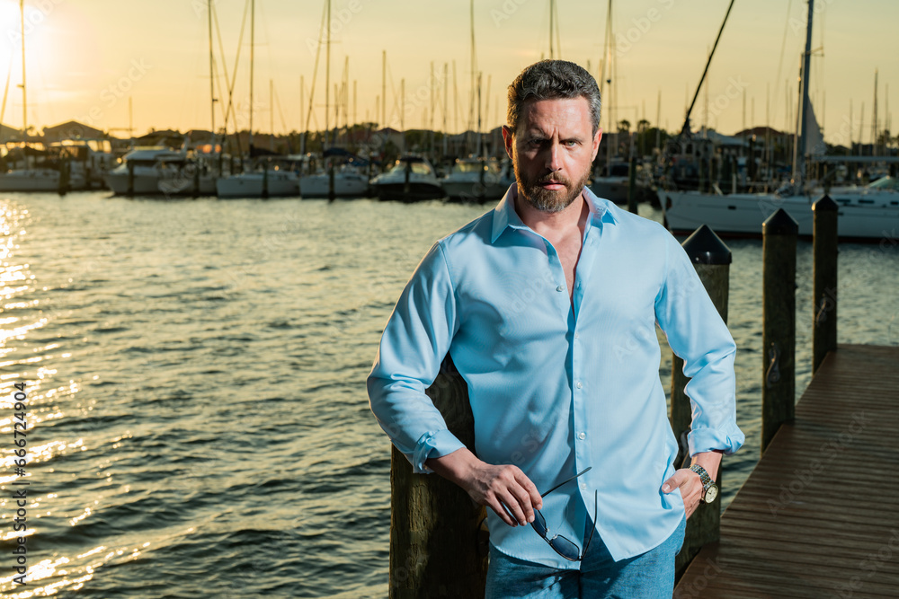 Rich summer business man near the yacht. Portrait of fashion male model ...