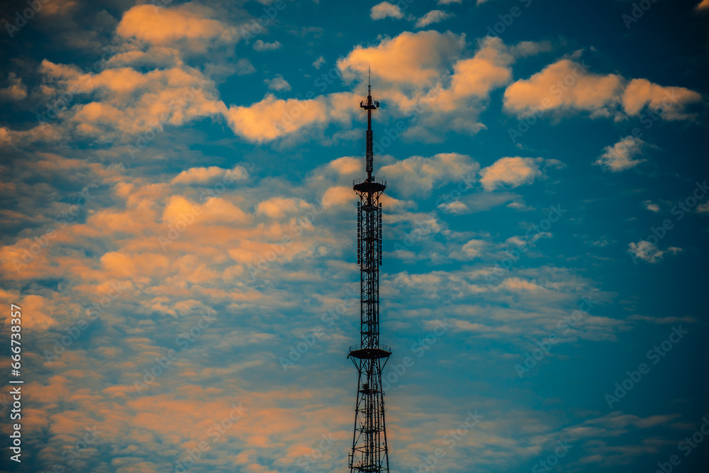 High-Rise Communications Tower Under Sunny Sky. High-tech ...