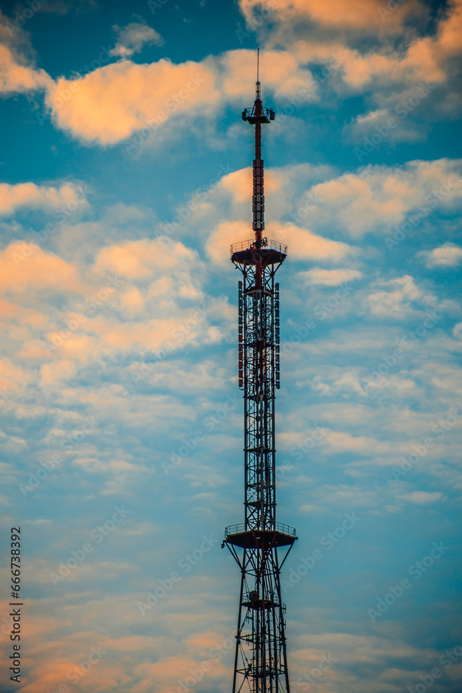 High-Rise Communications Tower Under Sunny Sky. High-tech ...
