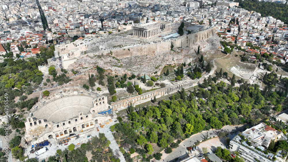 Aerial drone cinematic shot above unique Acropolis hill, the Parthenon, Odeon of Herodus Atticus ...
