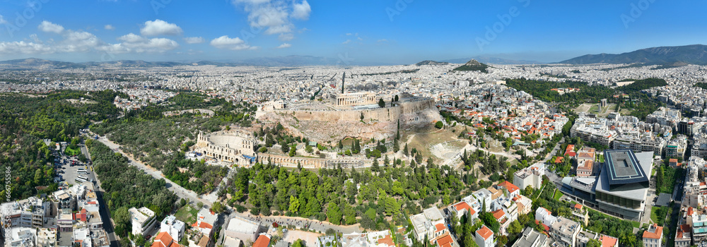 Aerial drone cinematic shot above unique Acropolis hill, the Parthenon, Odeon of Herodus Atticus ...