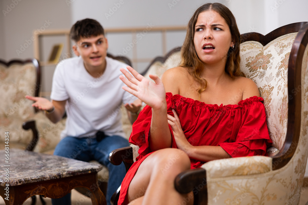 Young husband is dissatisfied with the act of his wife, scolding her ...