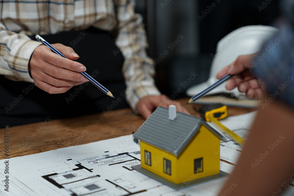 Póster Structural engineering team discusses and calculates office ...