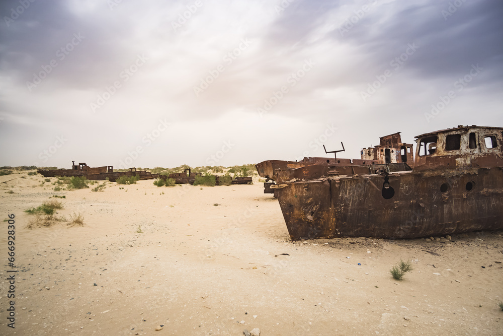 Rusty ships and boats in the desert at the bottom of the dried up Aral ...