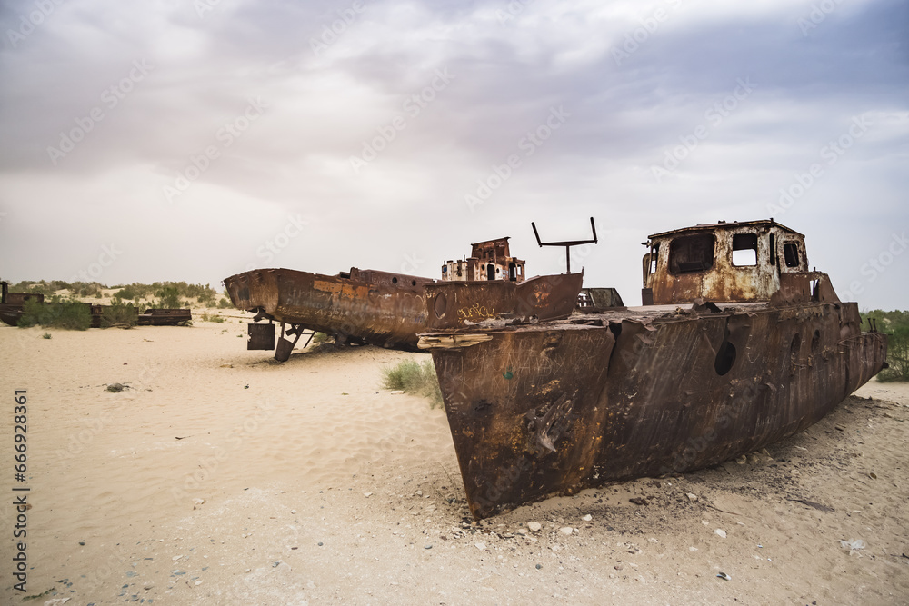 Rusty ships and boats in the desert at the bottom of the dried up Aral ...