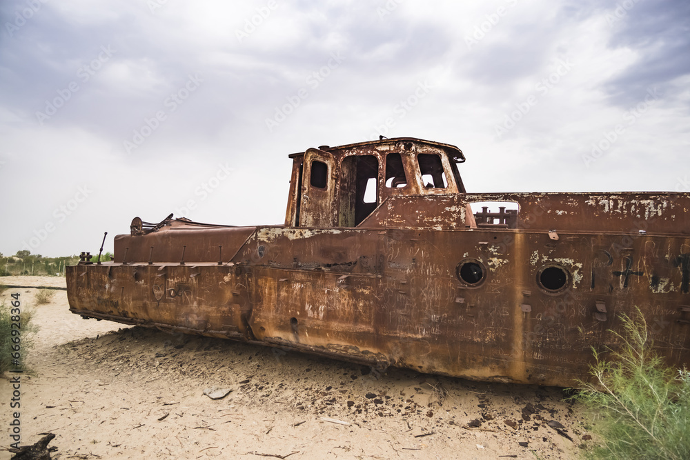 Rusty ships and boats in the desert at the bottom of the dried up Aral ...