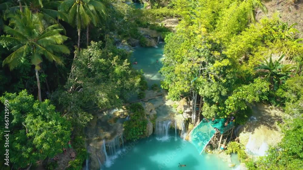Cambugahay falls, Siquijor island, Philippines. Slow aerial travelling ...