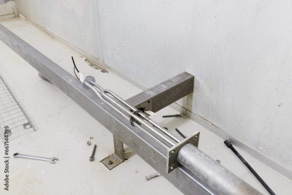 Repair and replacement of heating components in modern chicken hatching ...