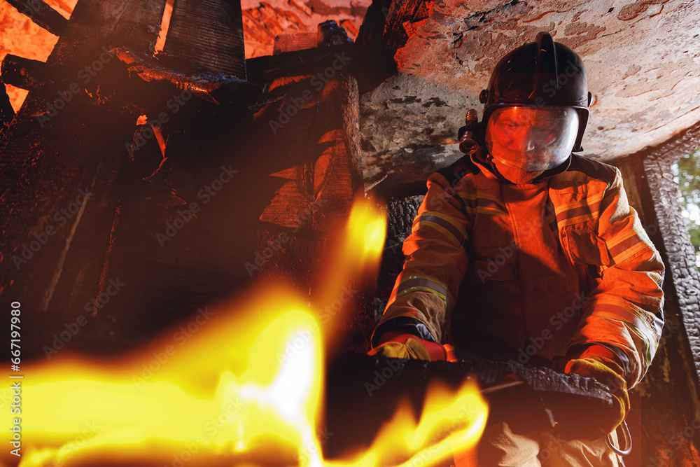 Brave Firefighter clears rubble from wooden floors in burning building ...