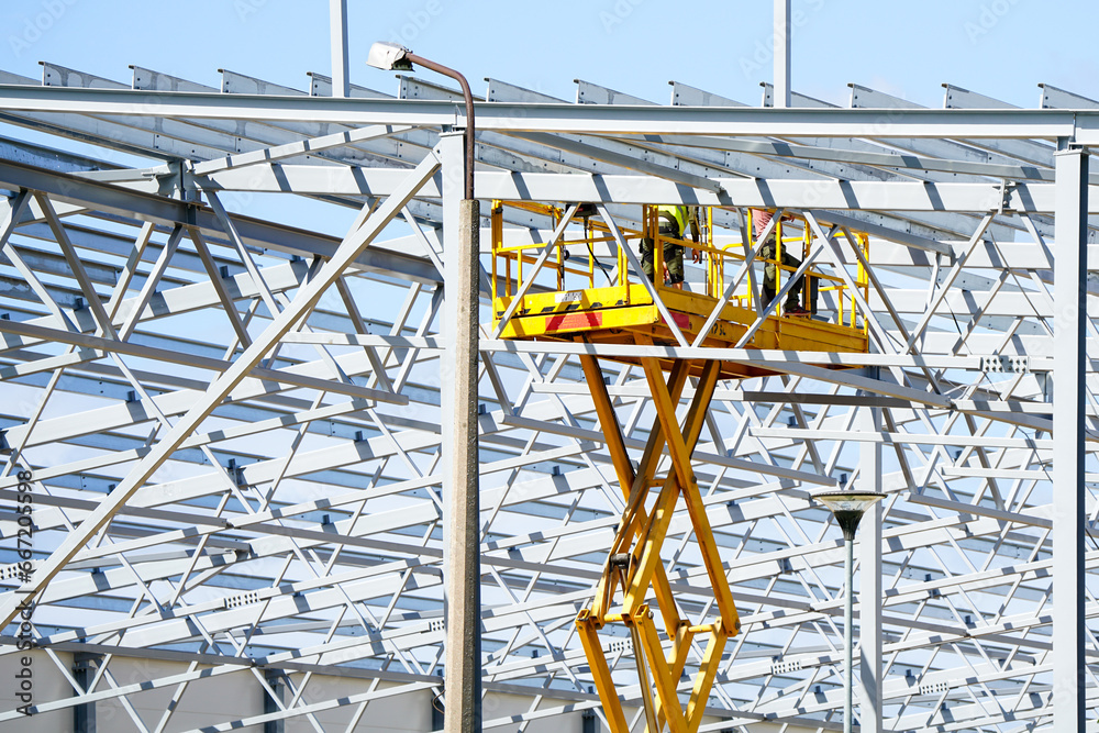 Complex large volume steel frame structure assembly using self ...