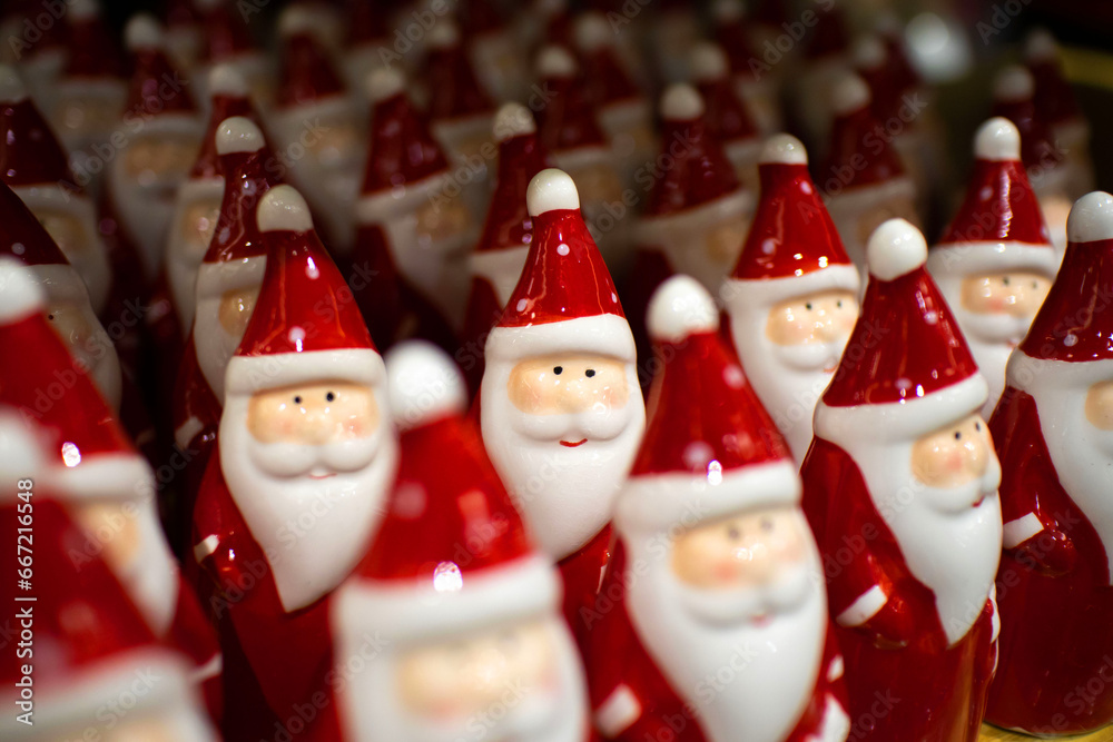 Small Santa Claus figures grouped together, one of them looking at the ...