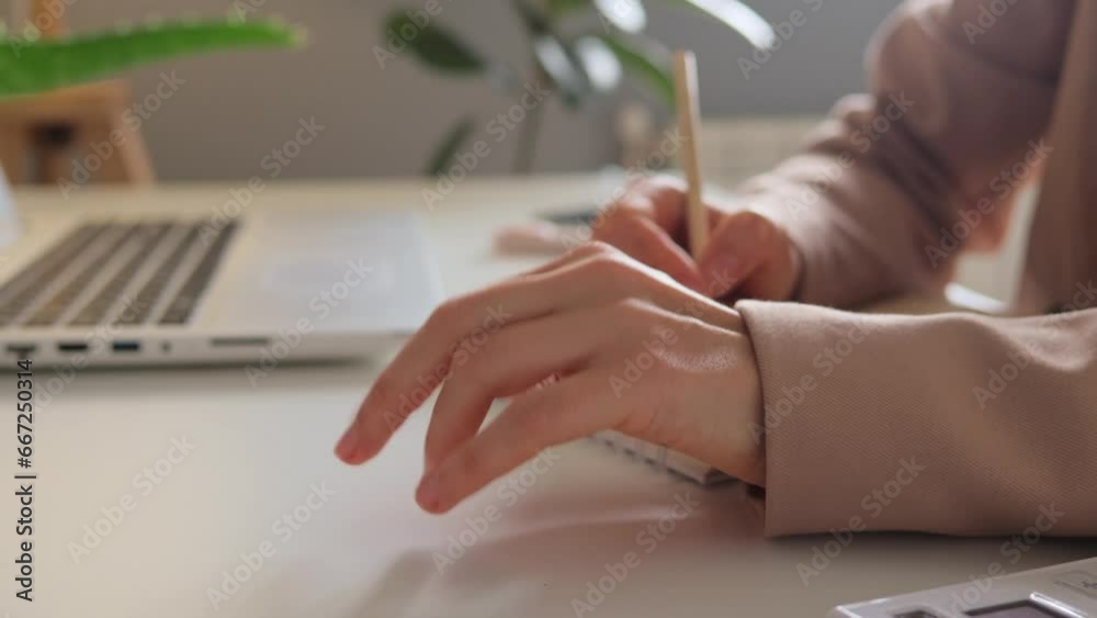 Side view of anonymous female's hand filled with stress rhythmically ...