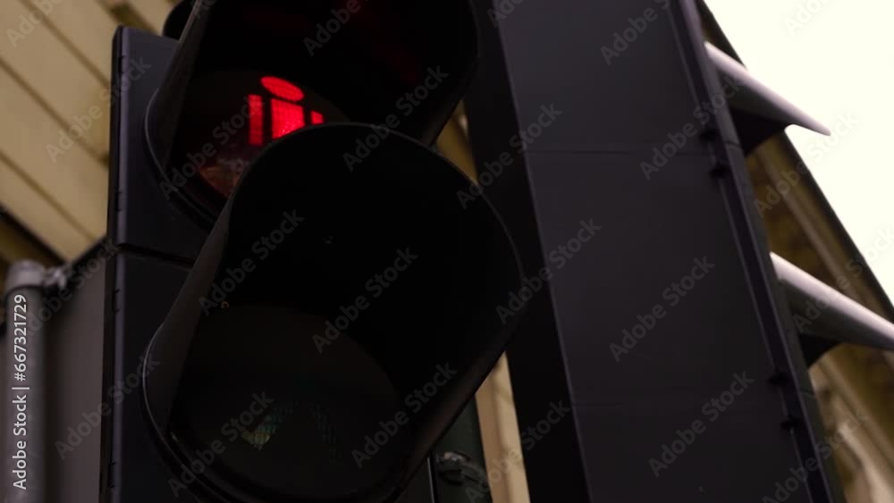 Close-up of traffic light at intersection of large city,regulating ...