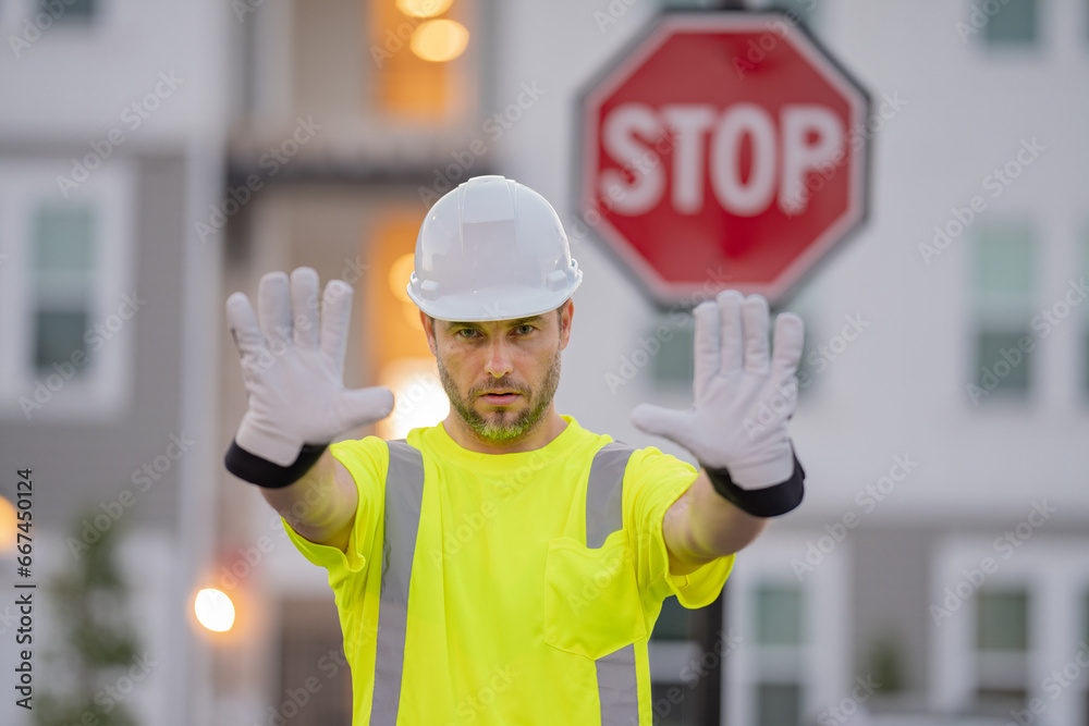 Builder with stop gesture, no hand, dangerous on building concept. Man ...