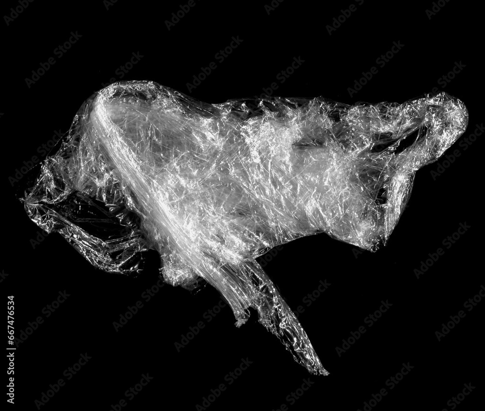 Wrinkled plastic wrap texture on a black background wallpaper. Royalty ...