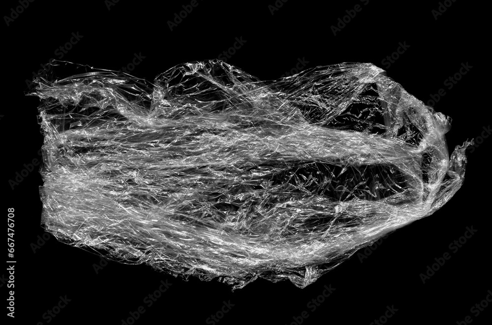 Wrinkled plastic wrap texture on a black background wallpaper. Royalty ...