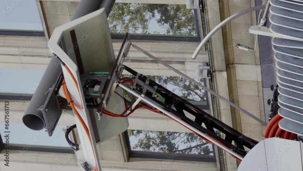 Vertical video of pantograph for electric bus charging at the bus ...