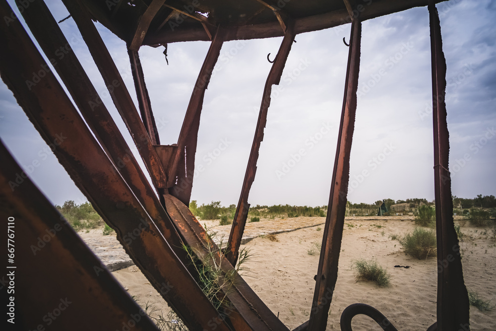 Rusty ships and boats in the desert at the bottom of the dried up Aral ...