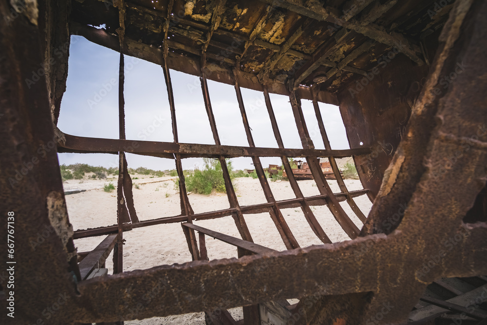 Rusty ships and boats in the desert at the bottom of the dried up Aral ...
