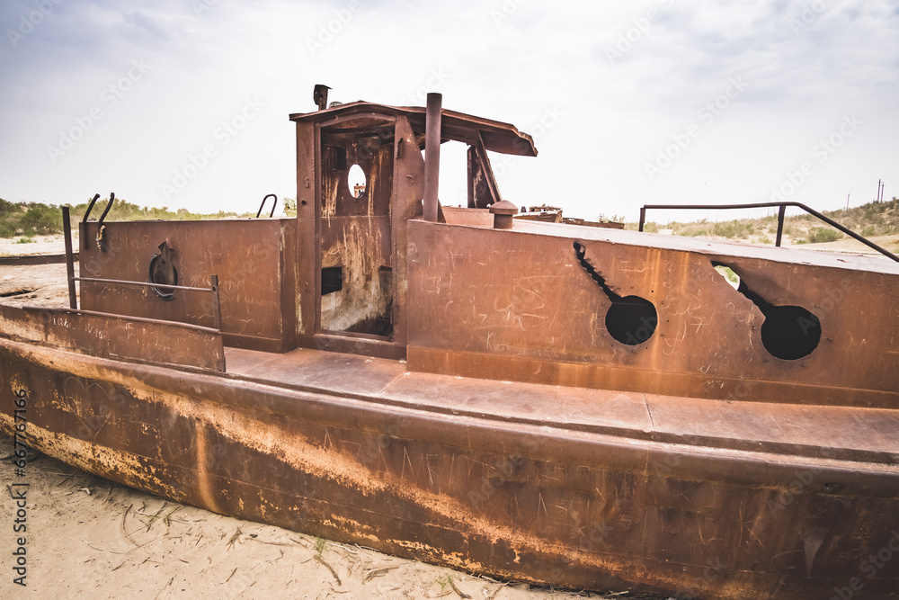 Rusty ships and boats in the desert at the bottom of the dried up Aral ...